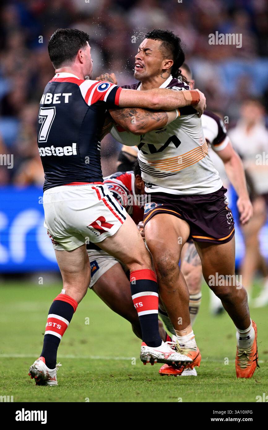 Xavier Willison of the Broncos is tackled by Chad Townsend of the ...