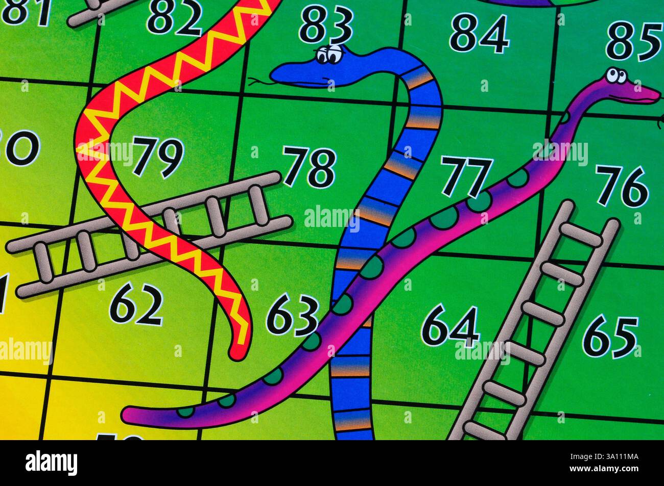 Snakes and ladders boardgame for children Stock Photo - Alamy