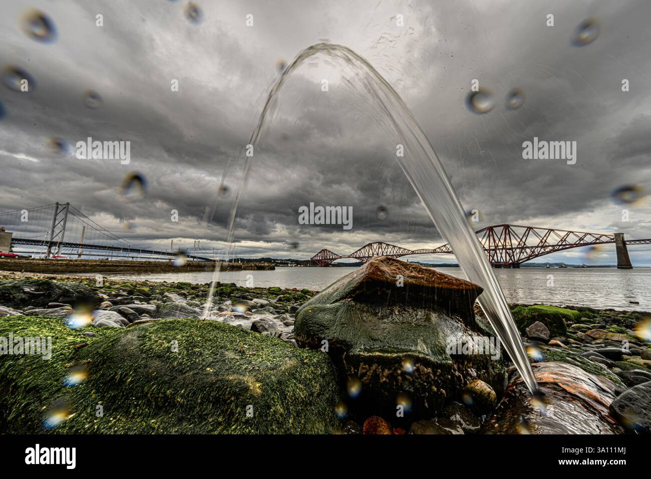 Scottish Grey Sky Day With A Fountain of Water From A Burst Water Pipe ...