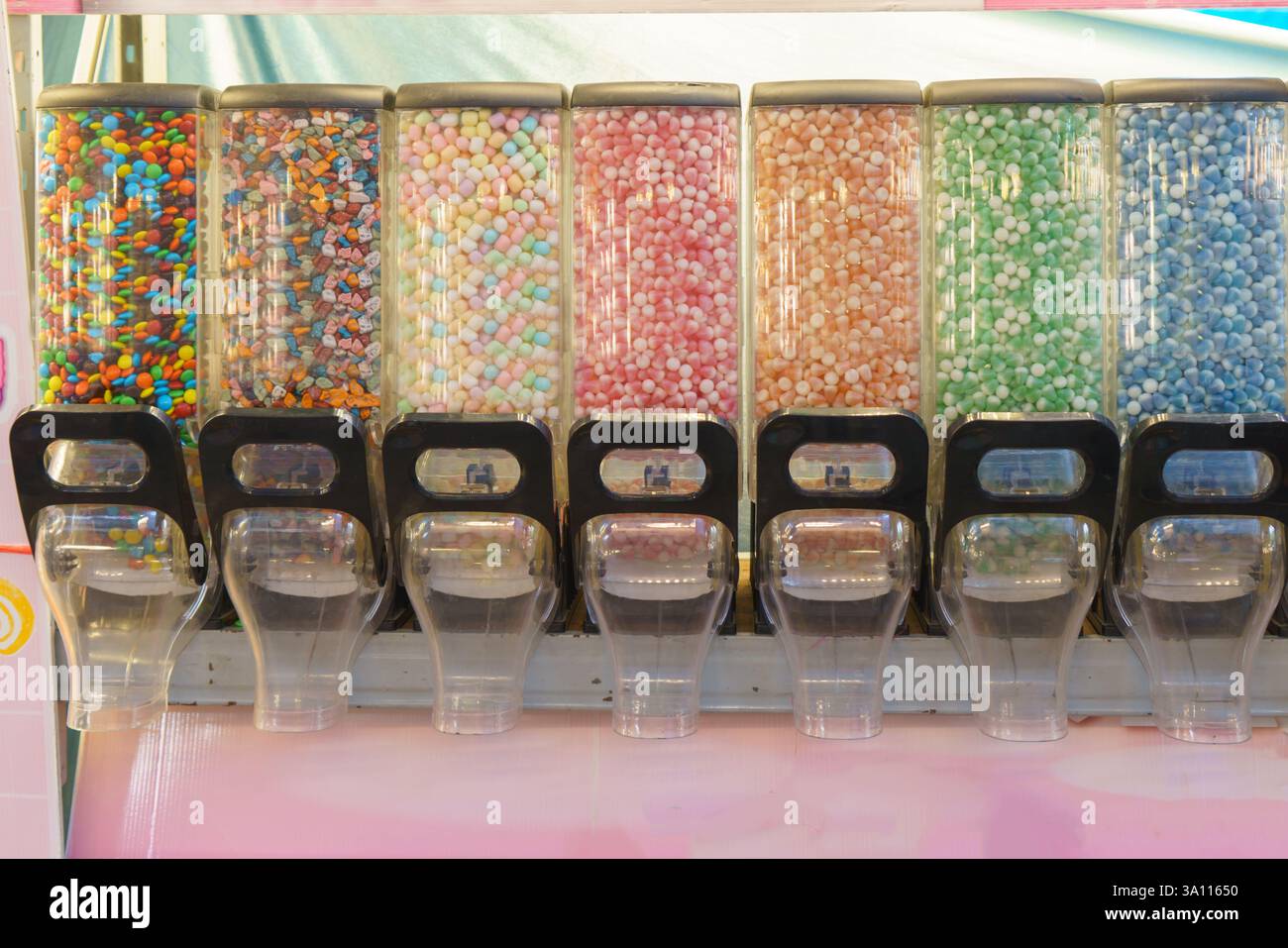 close-up shot of multiple clear dispensers filled with an array of ...