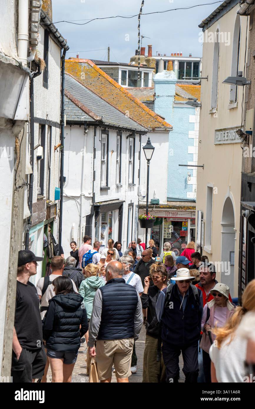 Cornwall - 21 June 2024: Tourists throng the quaint pedestrian streets ...