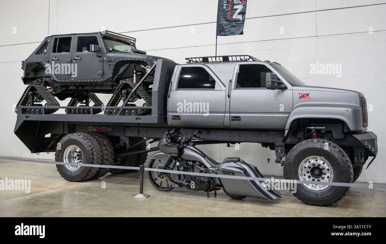 DETROIT, MI/USA - February 28, 2025: A custom GMC Topkick truck, Jeep ...