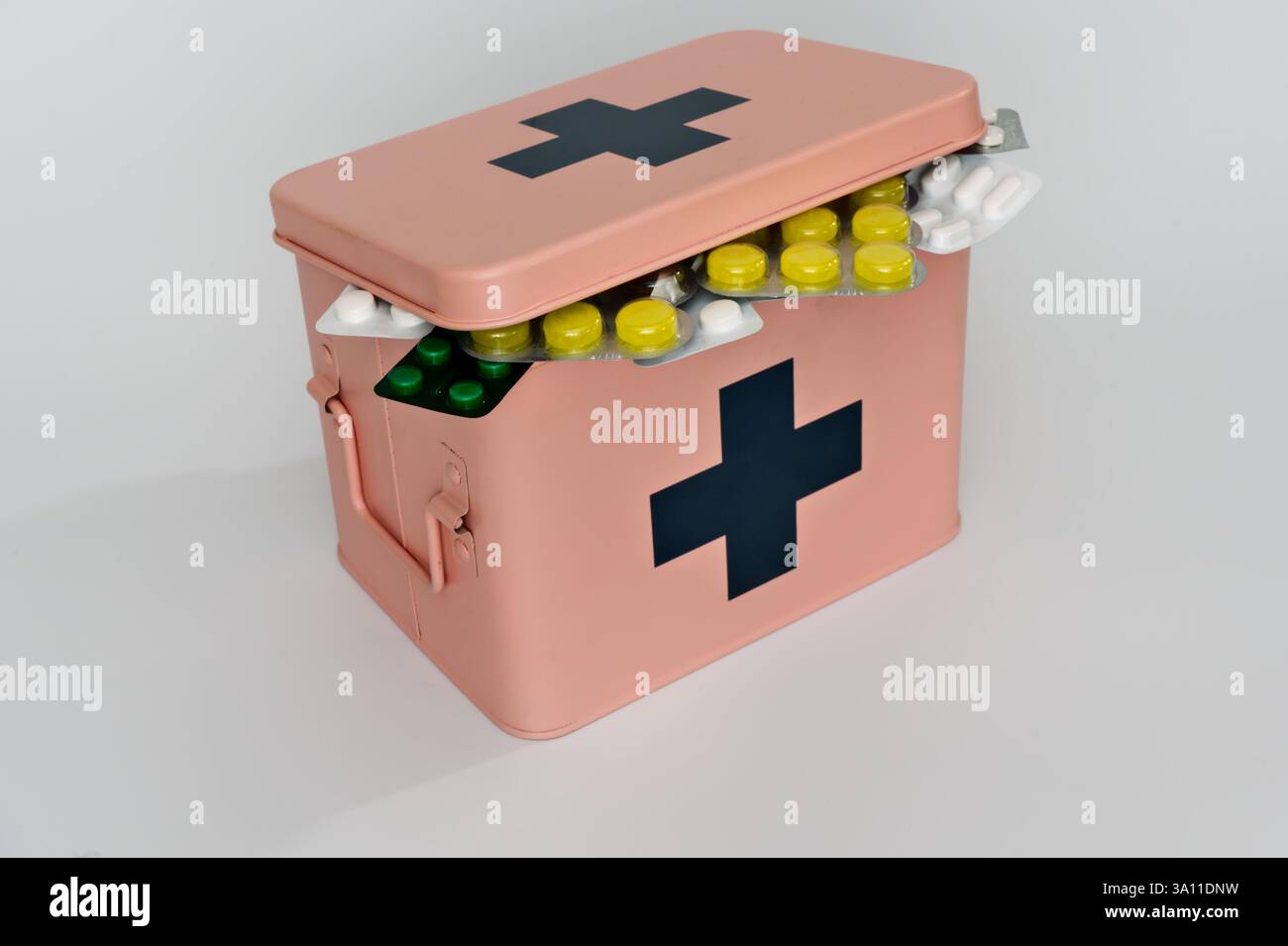 A pink first aid box with a black cross is open Stock Photo - Alamy