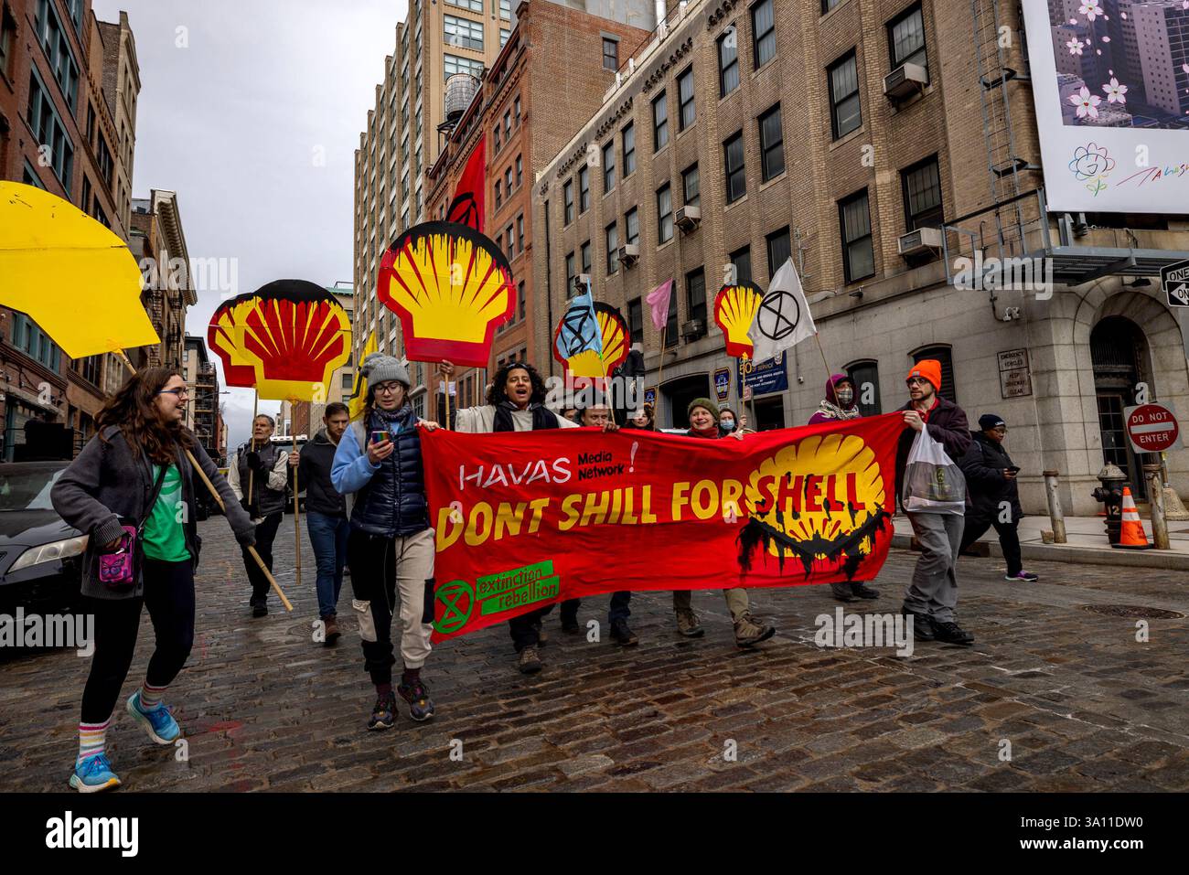 Members of the climate activist group Extinction Rebellion protest ...