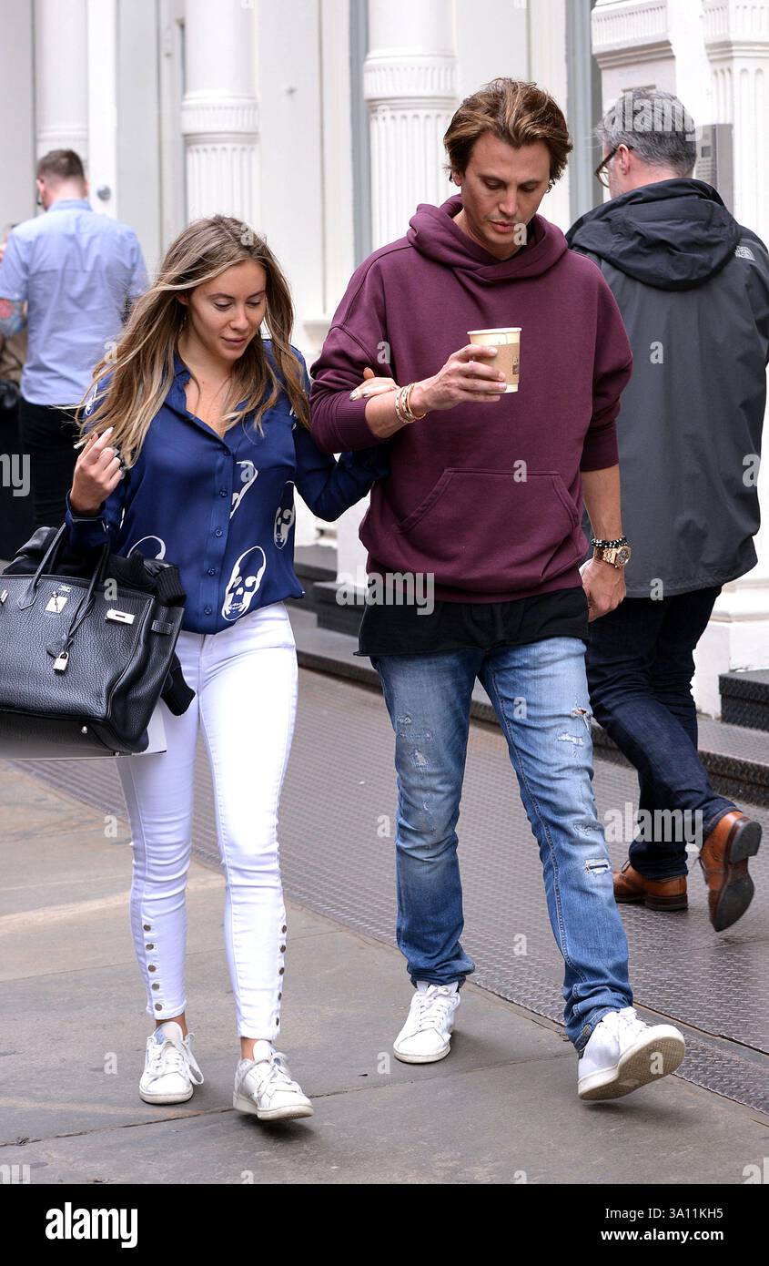 TV personality Jonathan Cheban and his girlfriend Anat Popovsky walk in ...