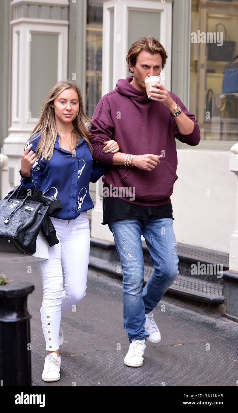 TV personality Jonathan Cheban and his girlfriend Anat Popovsky walk in ...