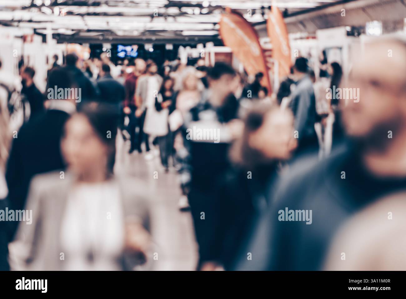 Abstract blurred people at exhibition hall of expo event trade show ...