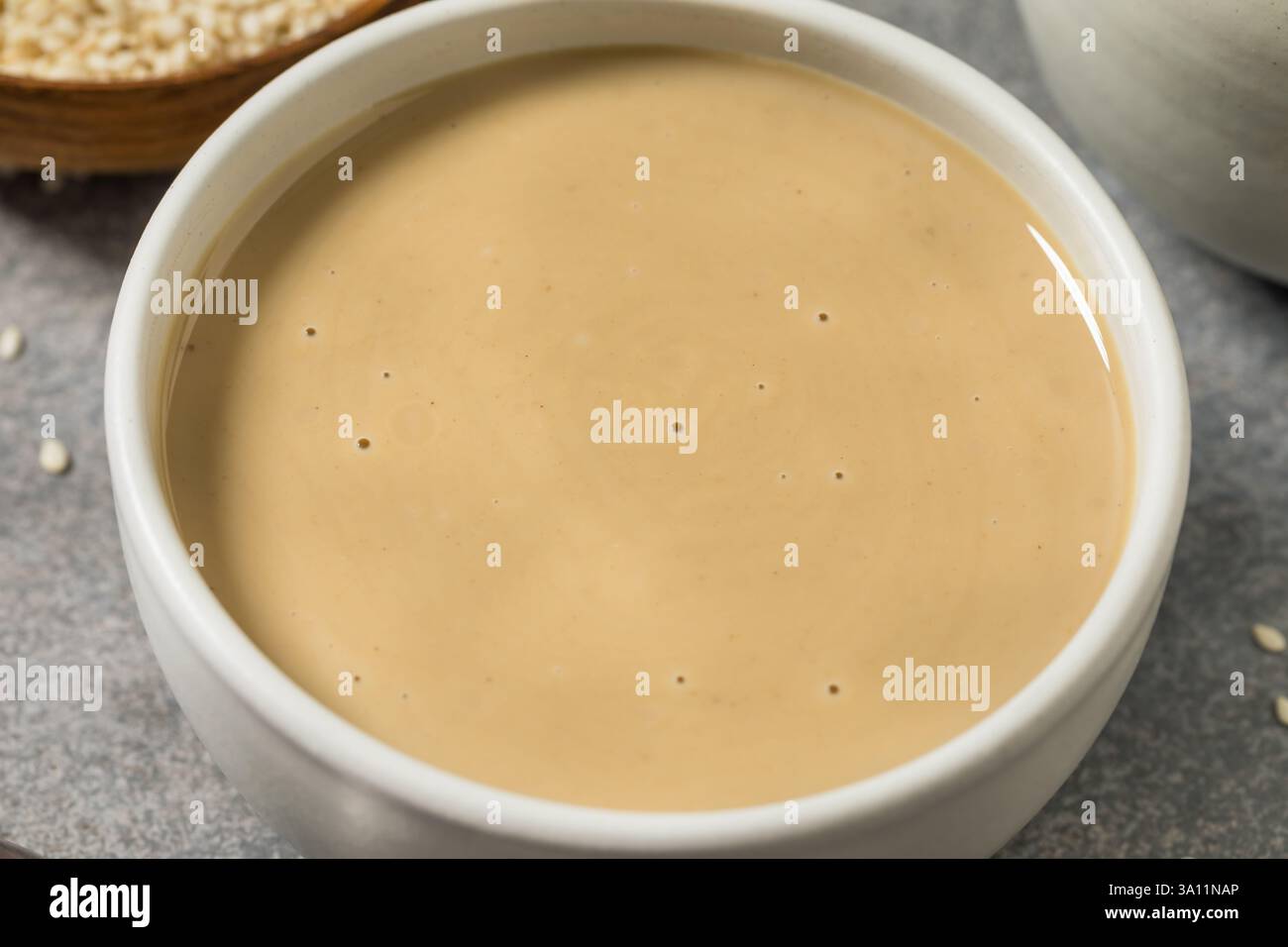 Homemade Organic Tahini Paste Sauce in a Bowl Stock Photo - Alamy