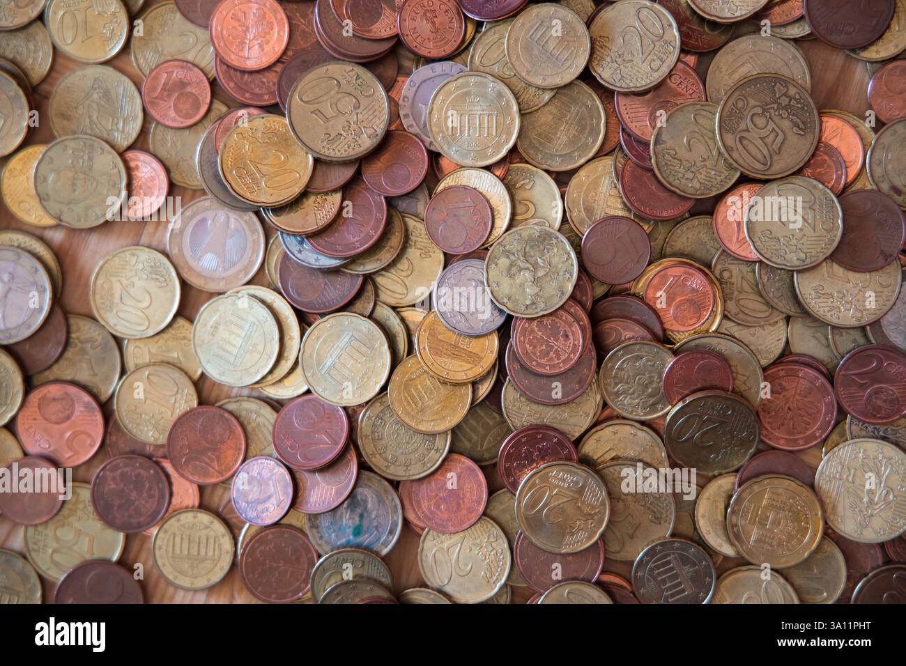 A large collection of mixed coins from different countries, showcasing ...