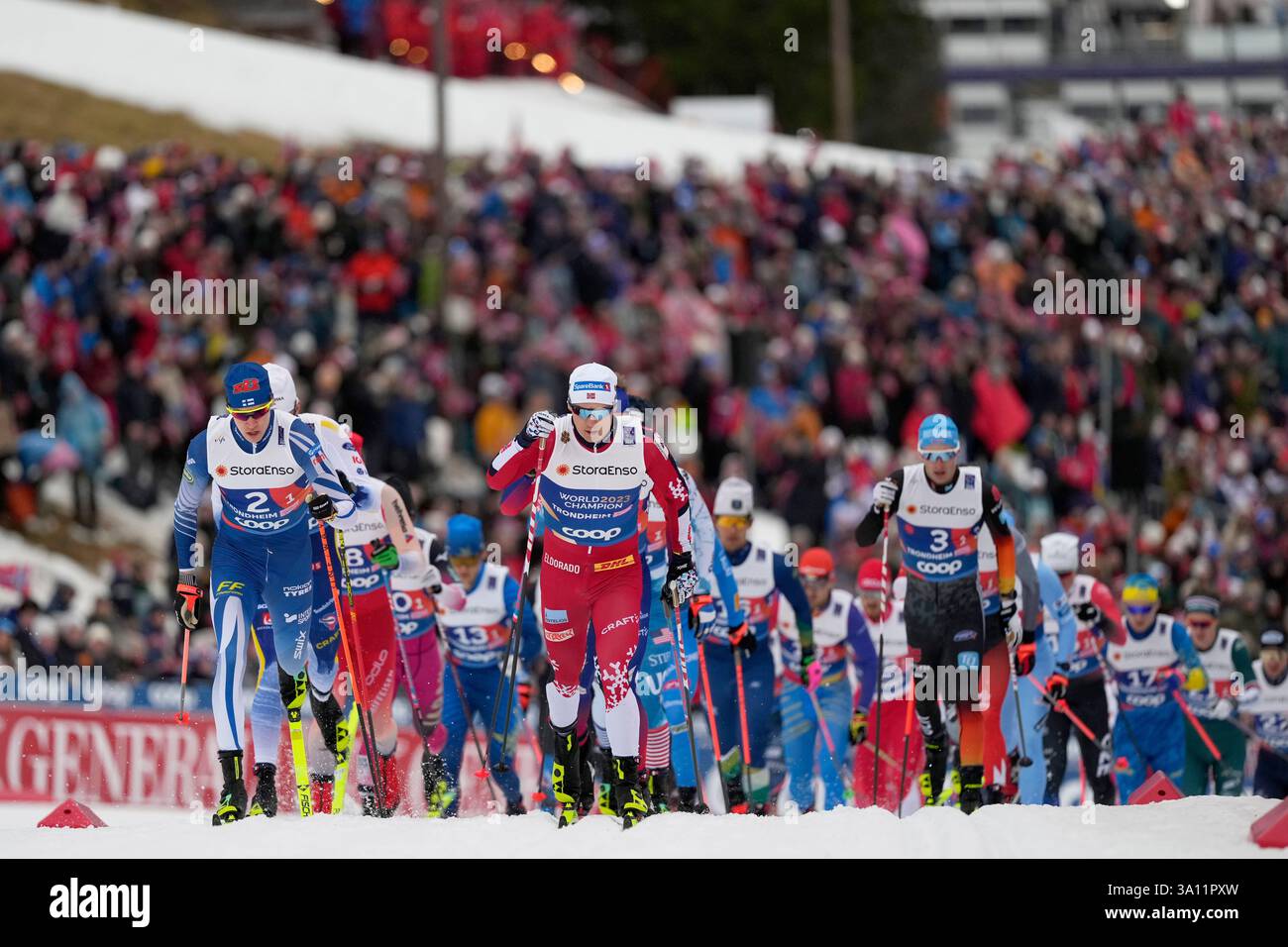 Erik Valnes, of Norway, center, leads at the start of the cross-country ...