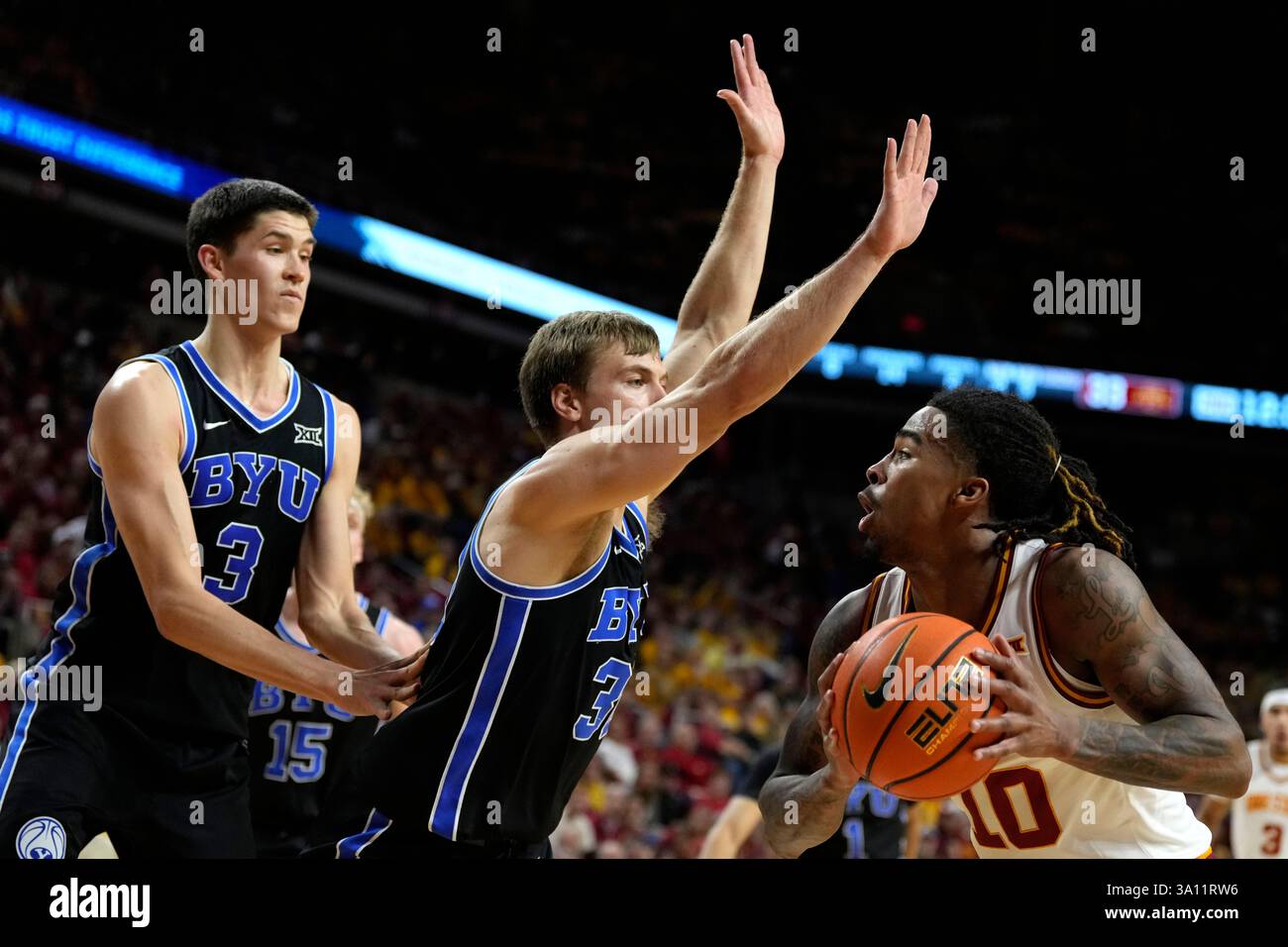 Iowa State guard Keshon Gilbert (10) looks to shoot over BYU guard ...