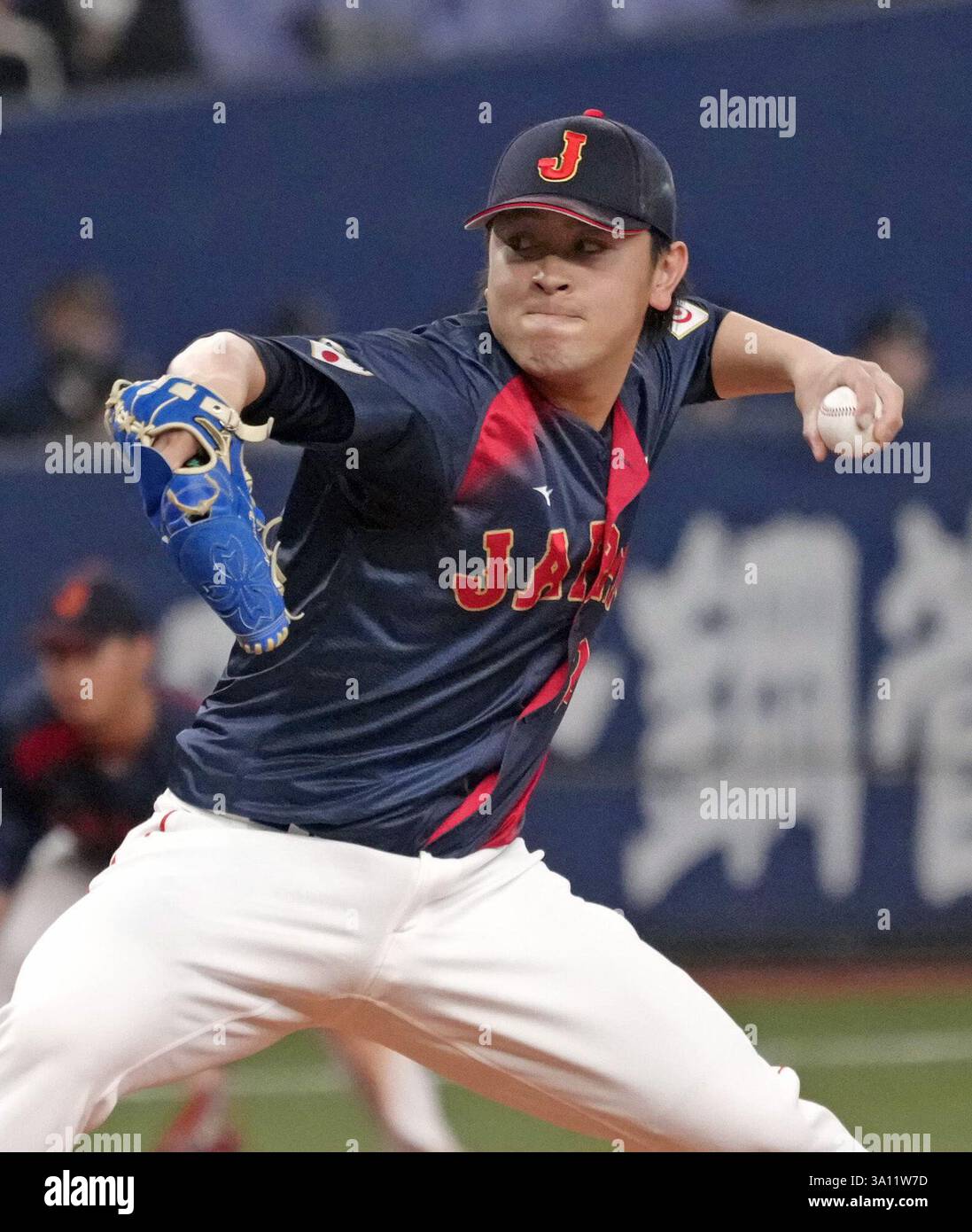Japan's Ryusei Kawano throws in the second game of a two-game baseball exhibition series against ...