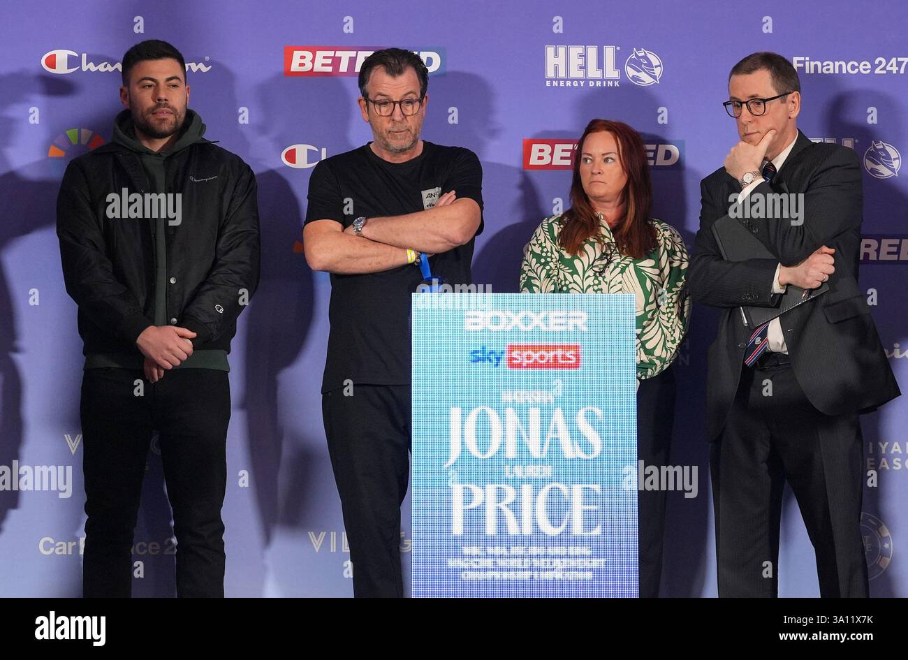Joe Gallagher (second left), trainer of boxer Natasha Jonas, appears to question the calibration ...