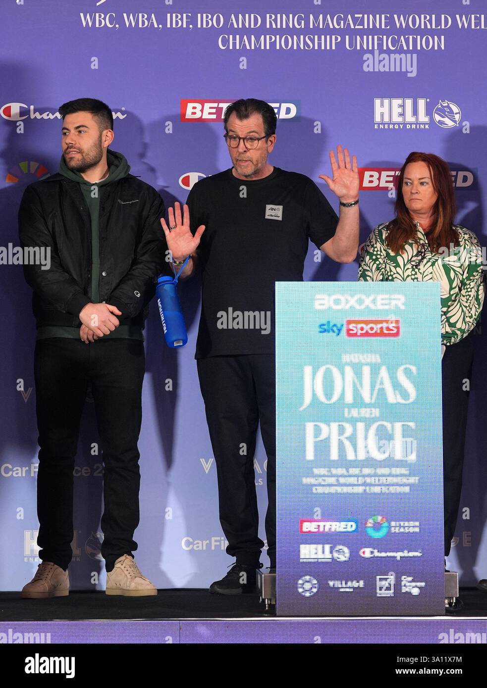 Joe Gallagher (centre), trainer of boxer Natasha Jonas, appears to ...