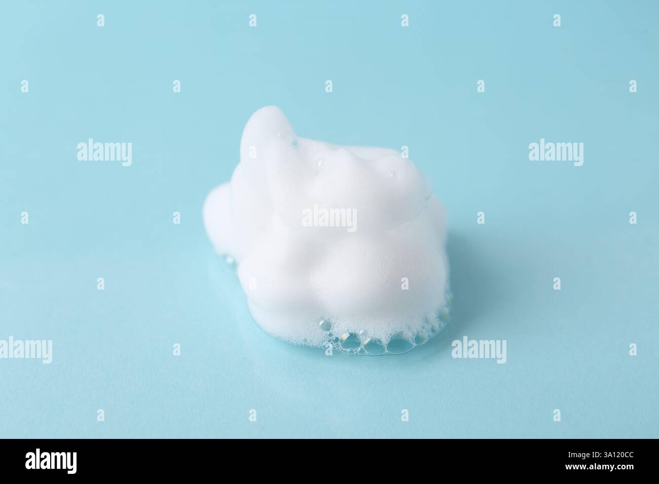 Sample of fluffy foam on light blue background Stock Photo - Alamy
