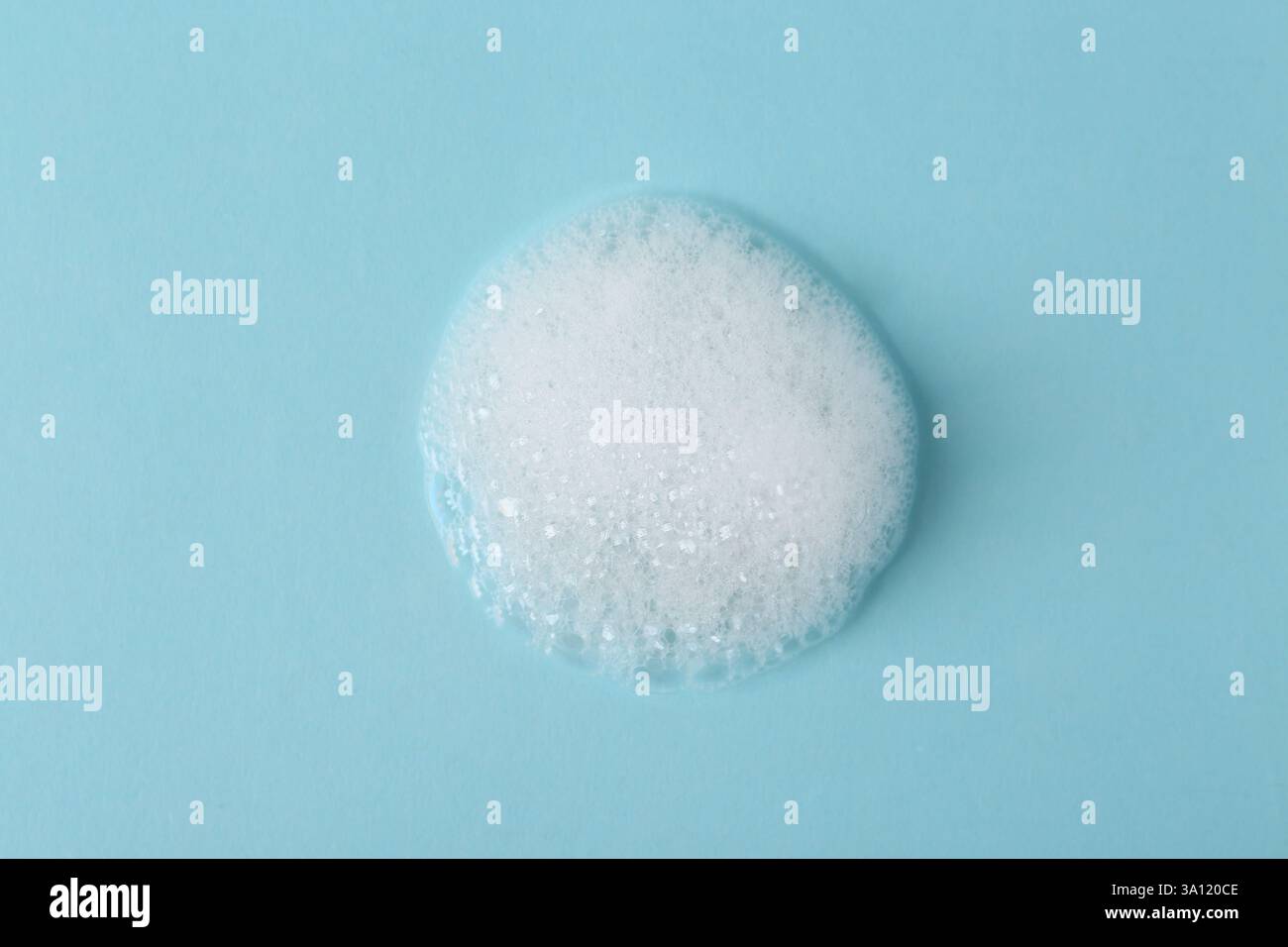 Sample of fluffy foam on light blue background, top view Stock Photo ...