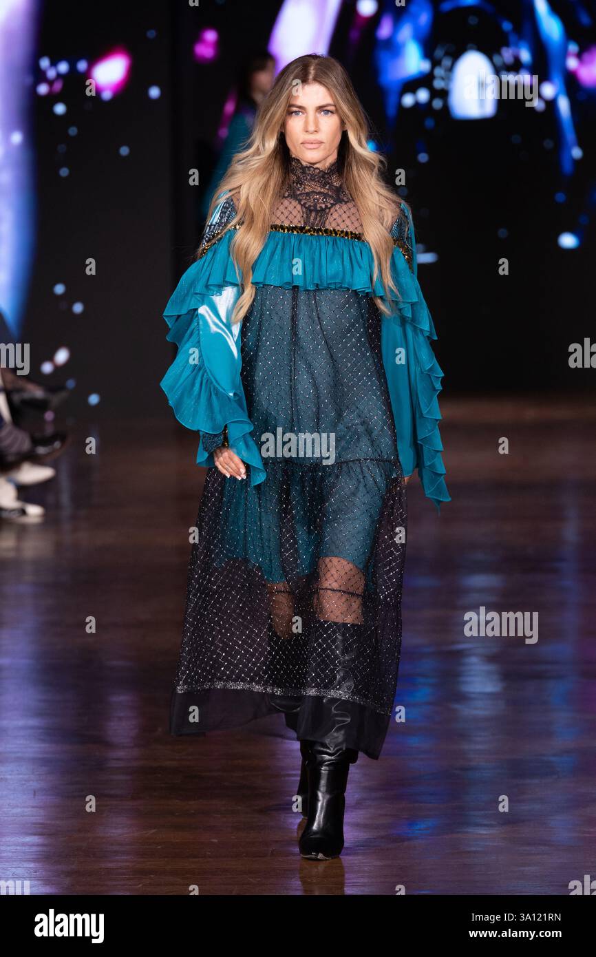 Milan, Italy. 24 Feb, 2025. A model walks the runway during the Custo ...