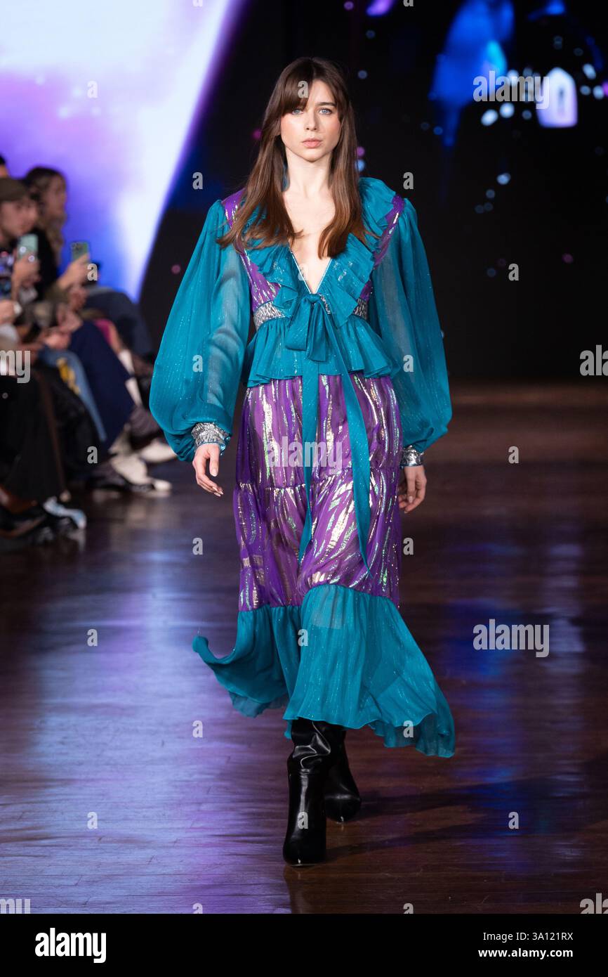 Milan, Italy. 24 Feb, 2025. A model walks the runway during the Custo ...