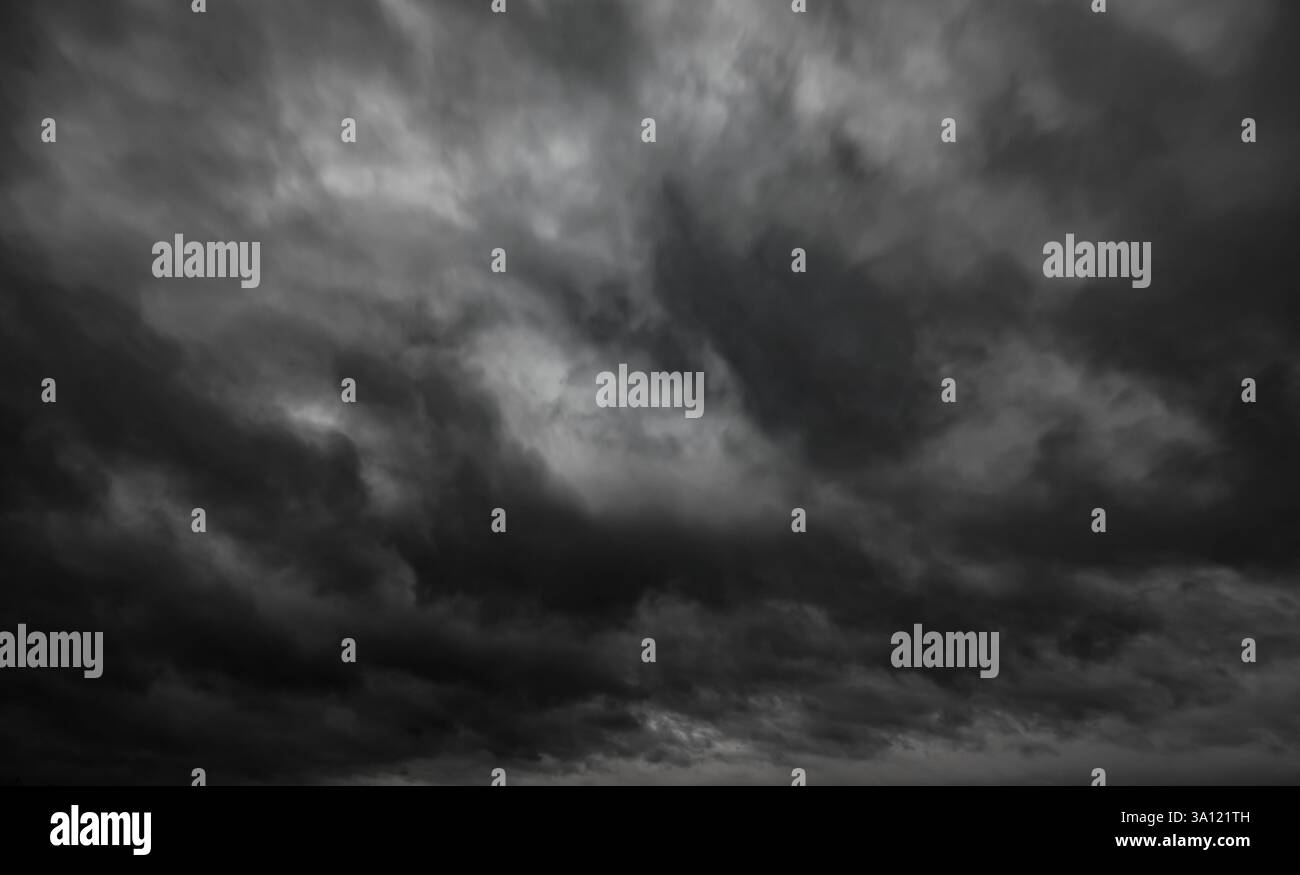 dark dramatic sky with black stormy clouds before rain as abstract ...
