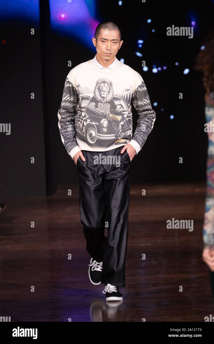Milan, Italy. 24 Feb, 2025. A model walks the runway during the Custo ...