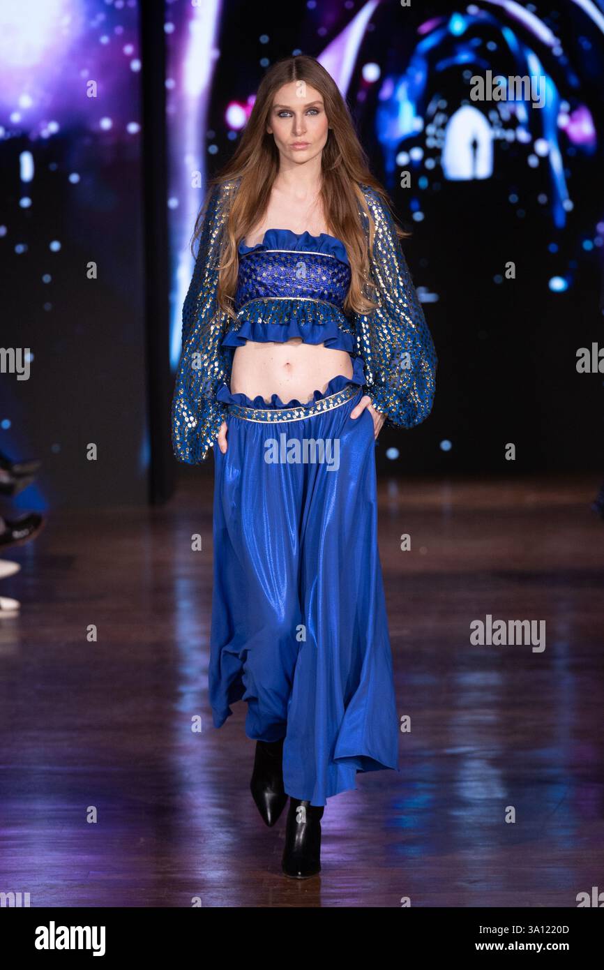 Milan, Italy. 24 Feb, 2025. A model walks the runway during the Custo ...