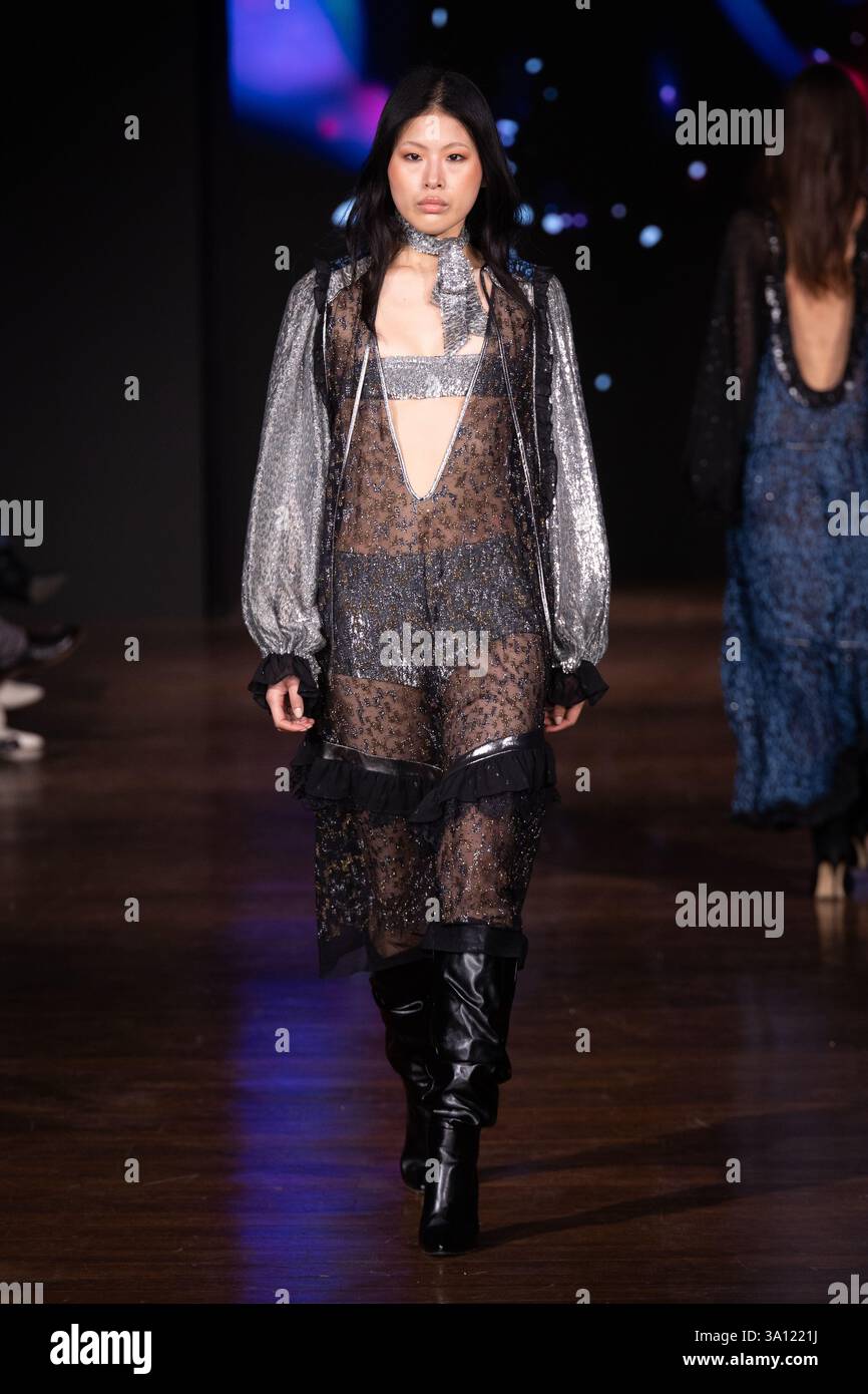 Milan, Italy. 24 Feb, 2025. A model walks the runway during the Custo ...