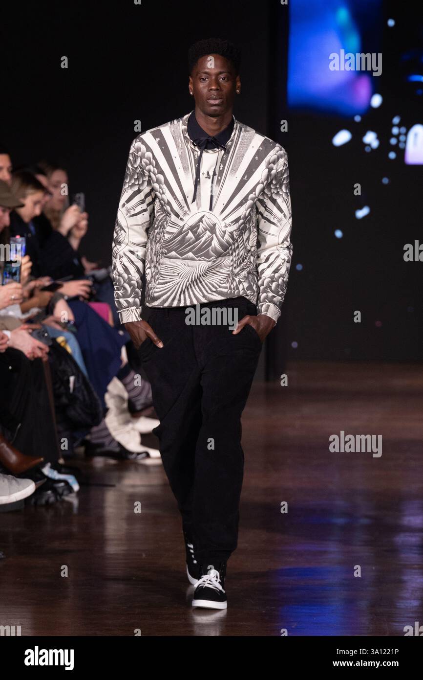 Milan, Italy. 24 Feb, 2025. A model walks the runway during the Custo ...
