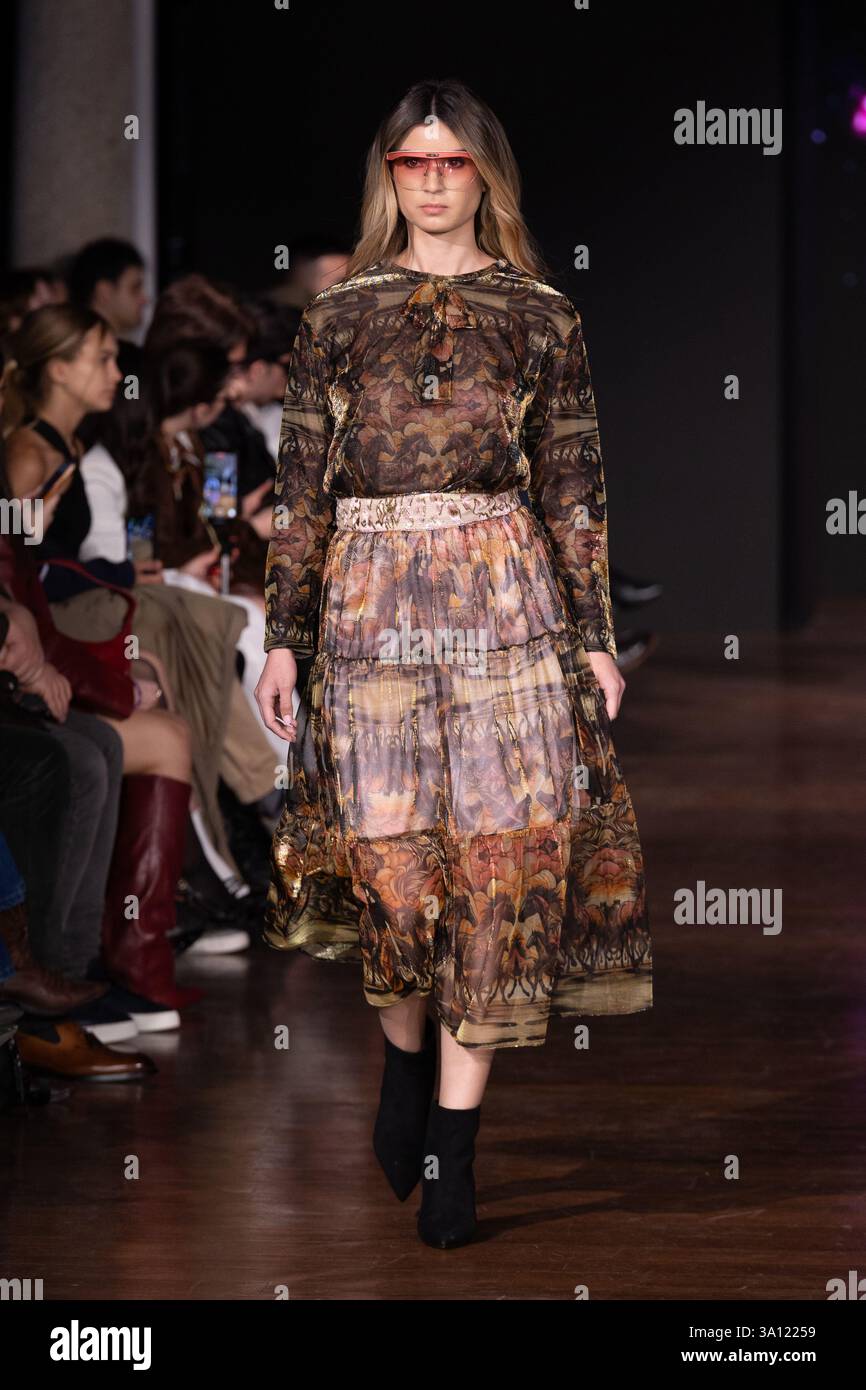 Milan, Italy. 24 Feb, 2025. A model walks the runway during the Custo ...