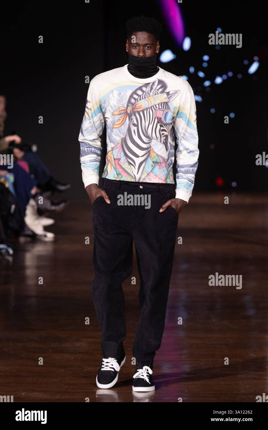 Milan, Italy. 24 Feb, 2025. A model walks the runway during the Custo ...