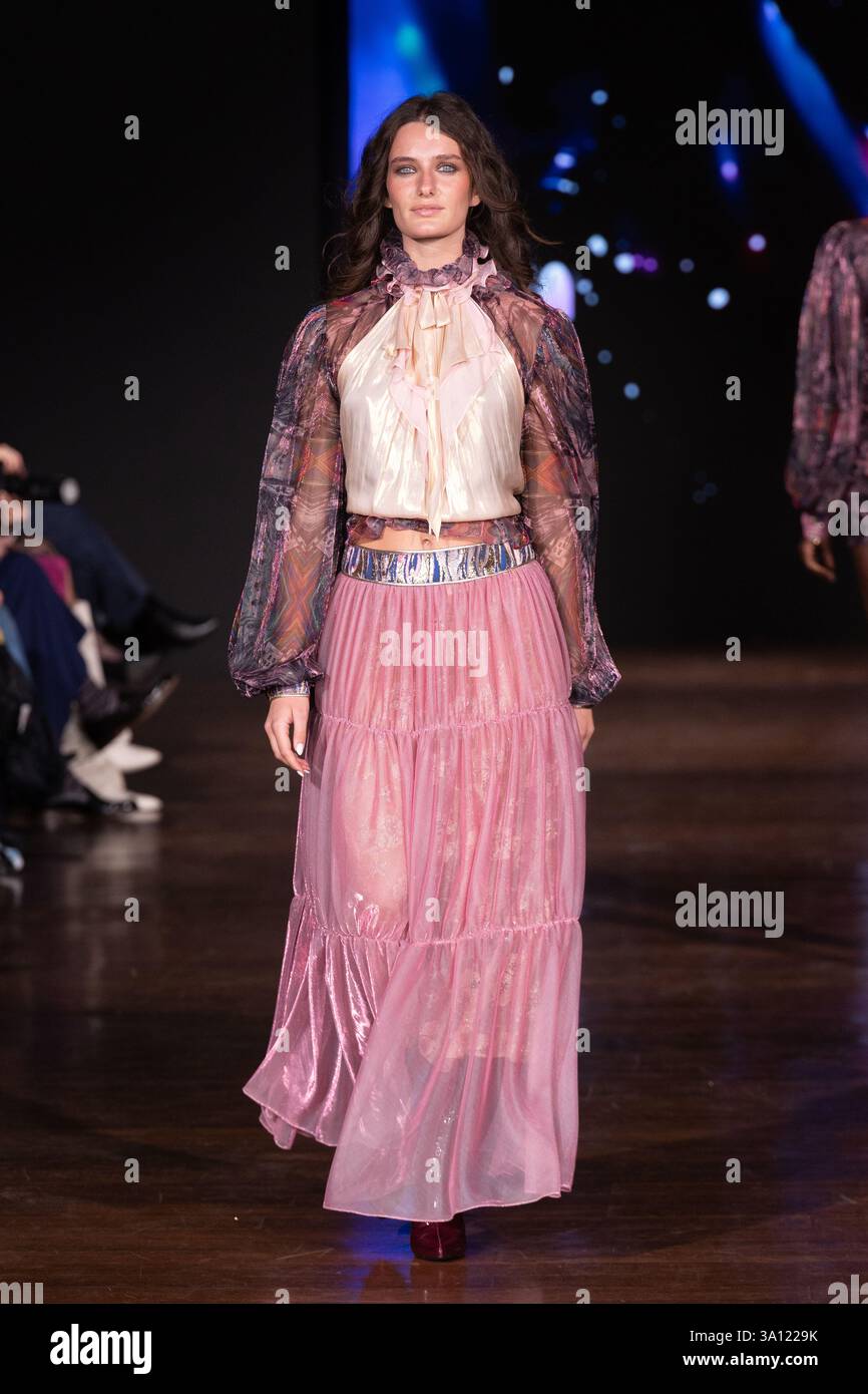 Milan, Italy. 24 Feb, 2025. A model walks the runway during the Custo ...