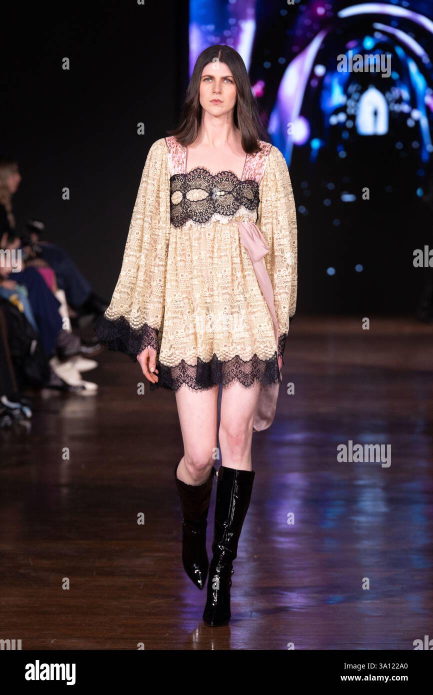 Milan, Italy. 24 Feb, 2025. A model walks the runway during the Custo ...