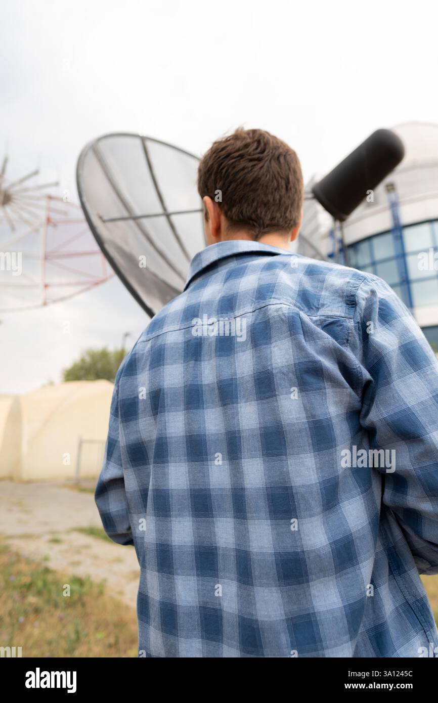 A specialist tests the connection at a mobile station after a breakdown ...