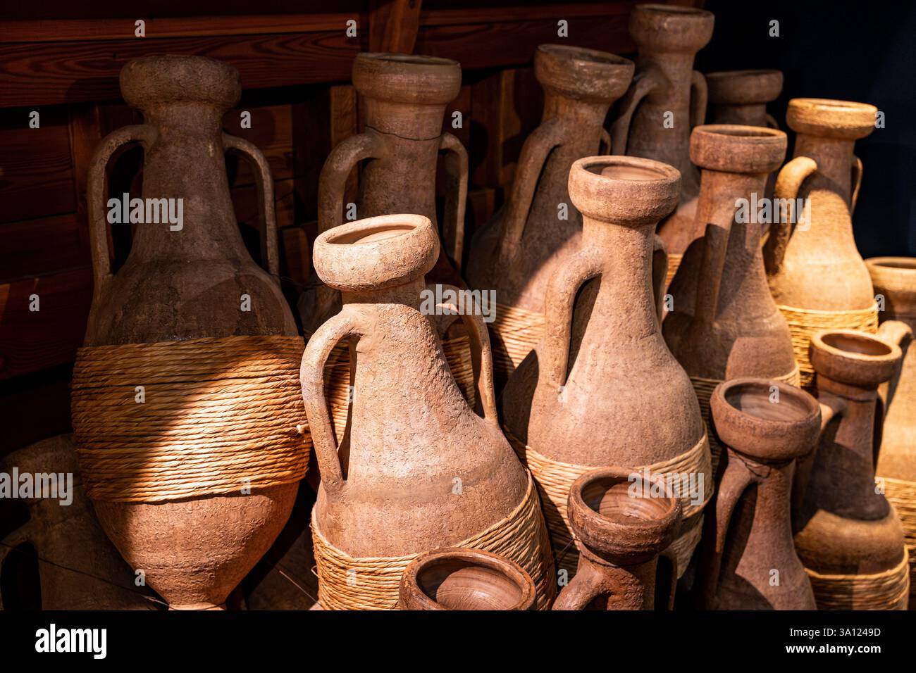 Ancient Etruscan Amphorae with Rope Wrapping in Rustic Museum Display ...