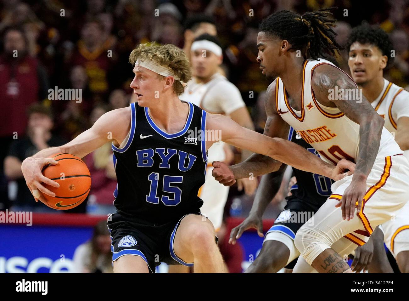 BYU forward Richie Saunders (15) drives around Iowa State guard Keshon ...
