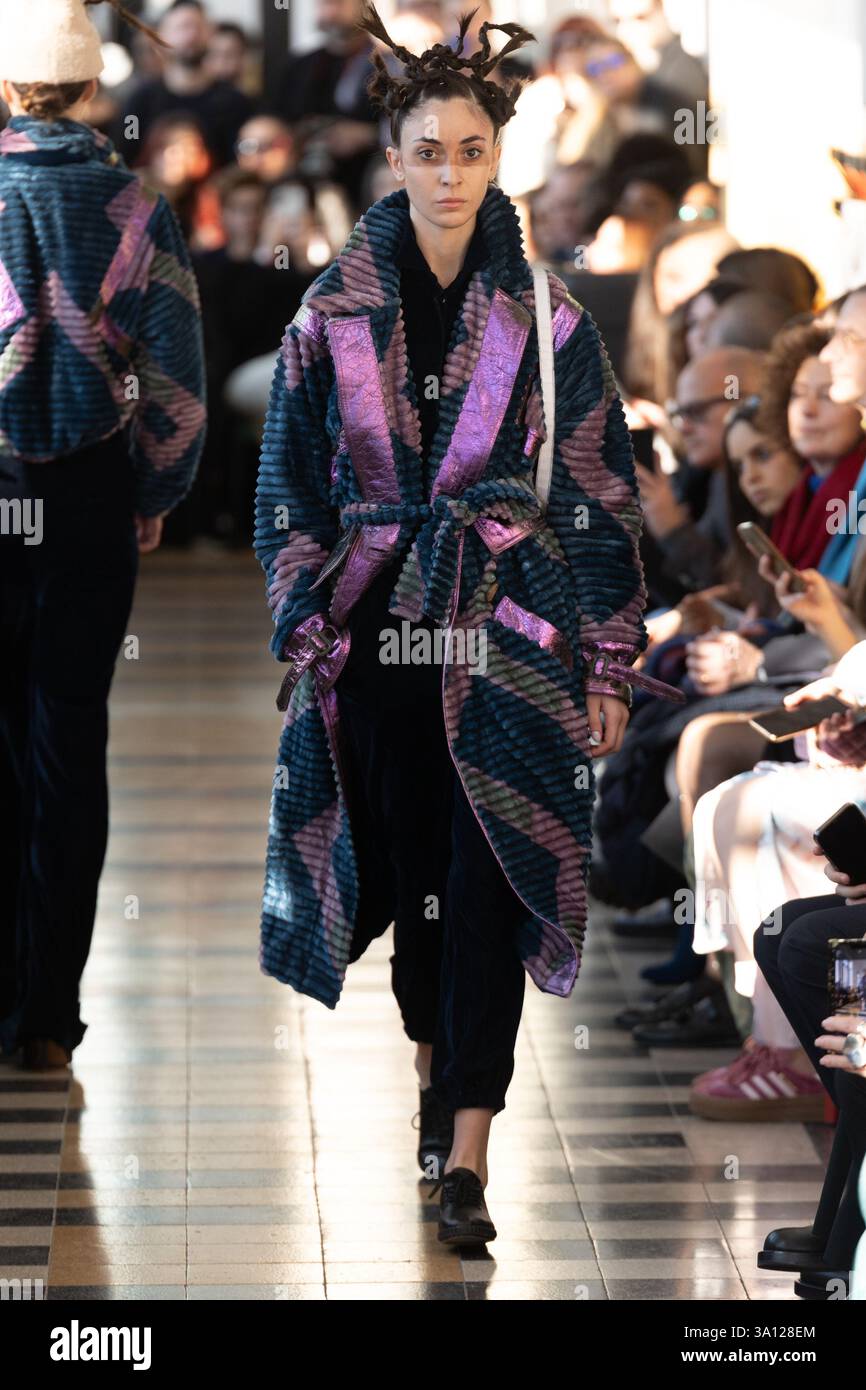 Milan, Italy. 2 Mar, 2025. A model walks the runway during the ...