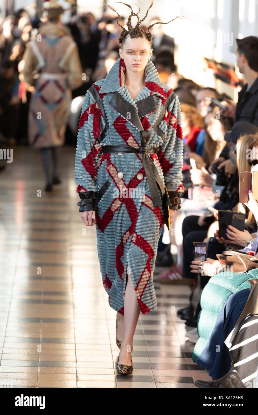 Milan, Italy. 2 Mar, 2025. A model walks the runway during the ...