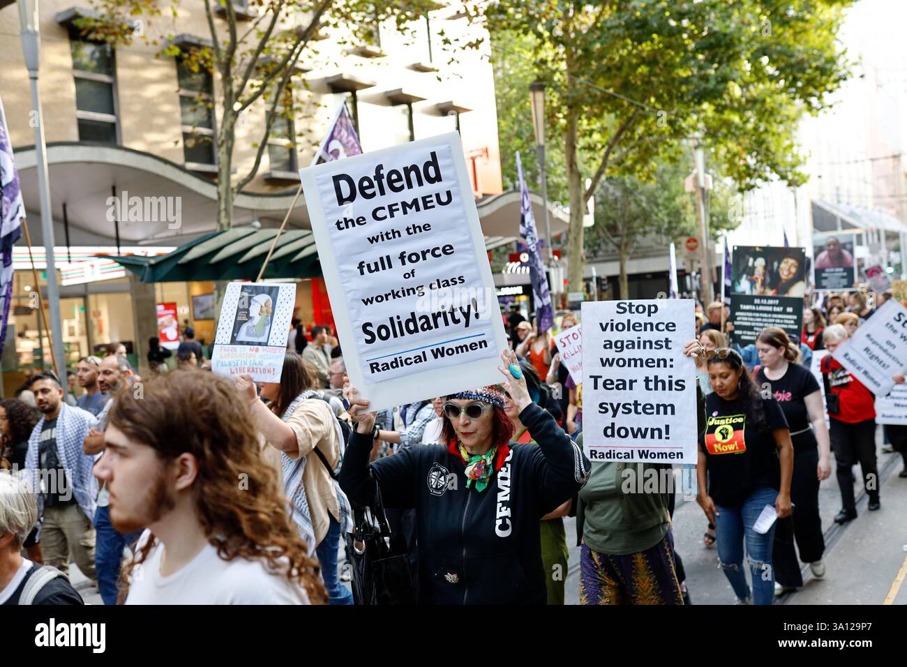 Protesters hold placards expressing their views during the ...