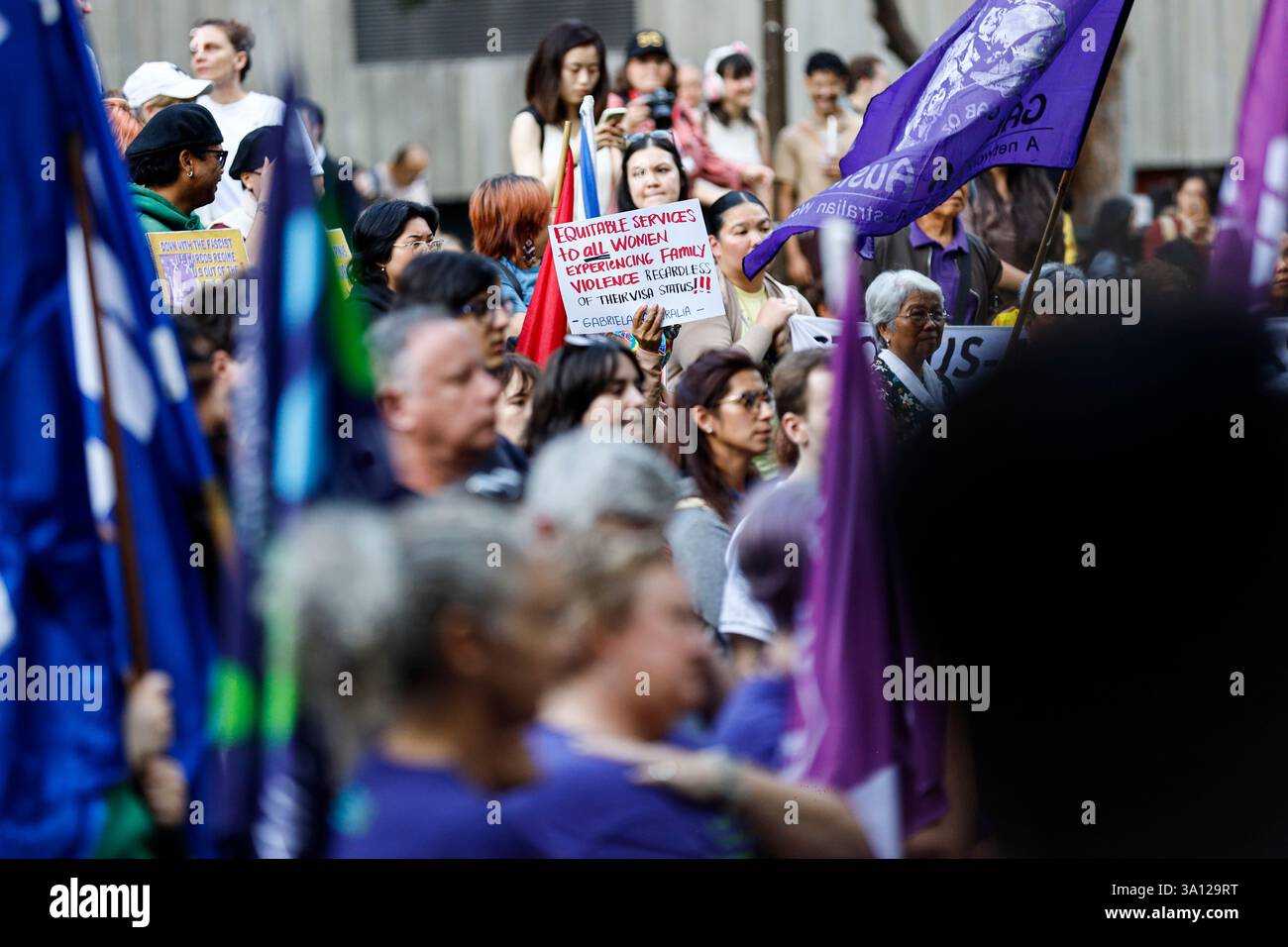 A protester holds a placard expressing her views during the ...