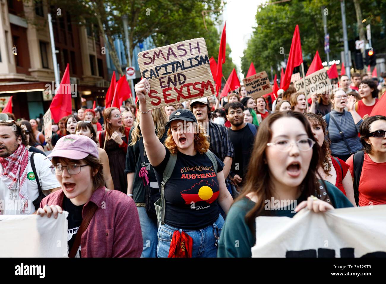 Protesters march with banners and signs while chanting slogans during ...