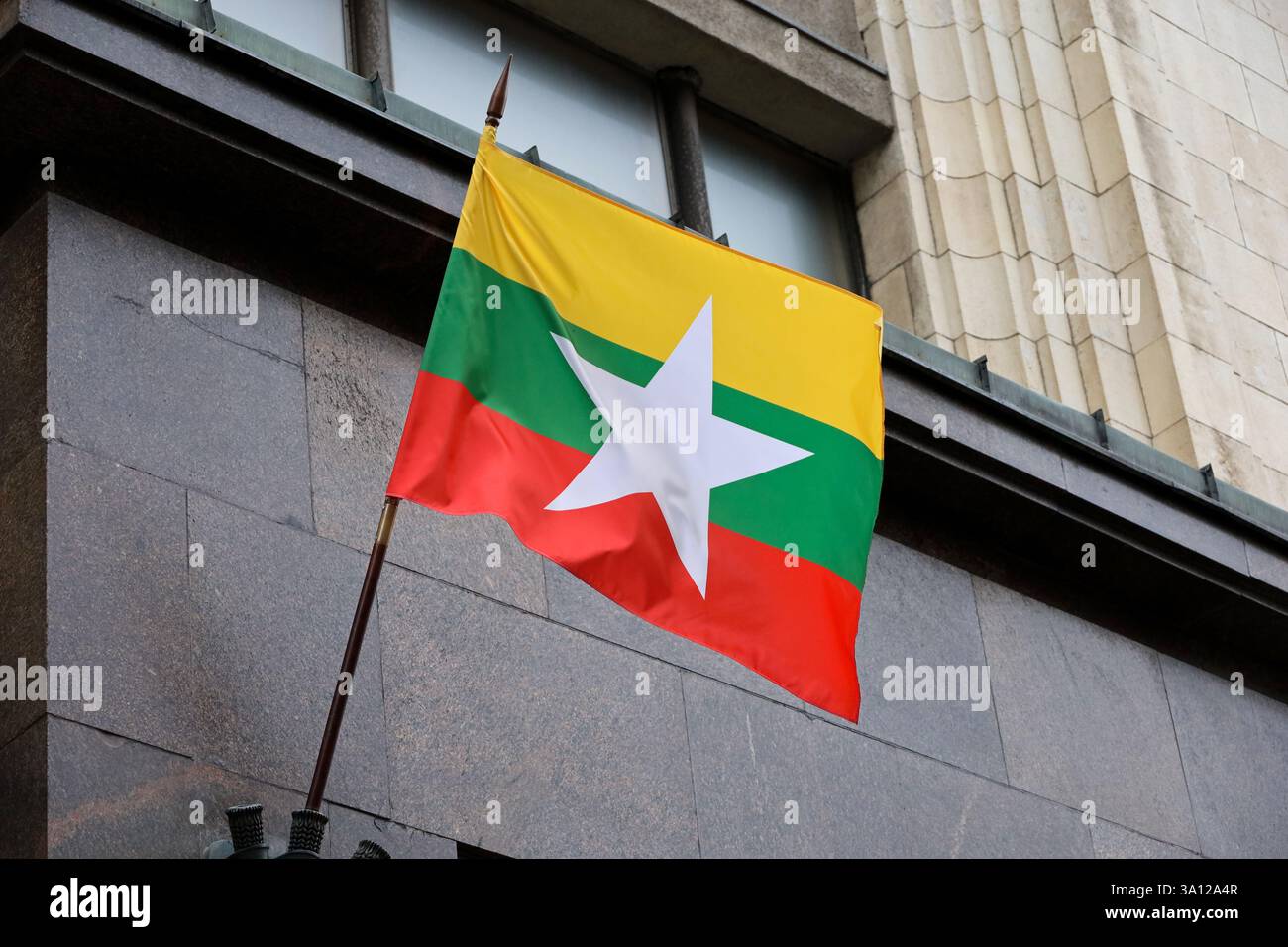 National flag of Myanmar on the building facade Stock Photo - Alamy