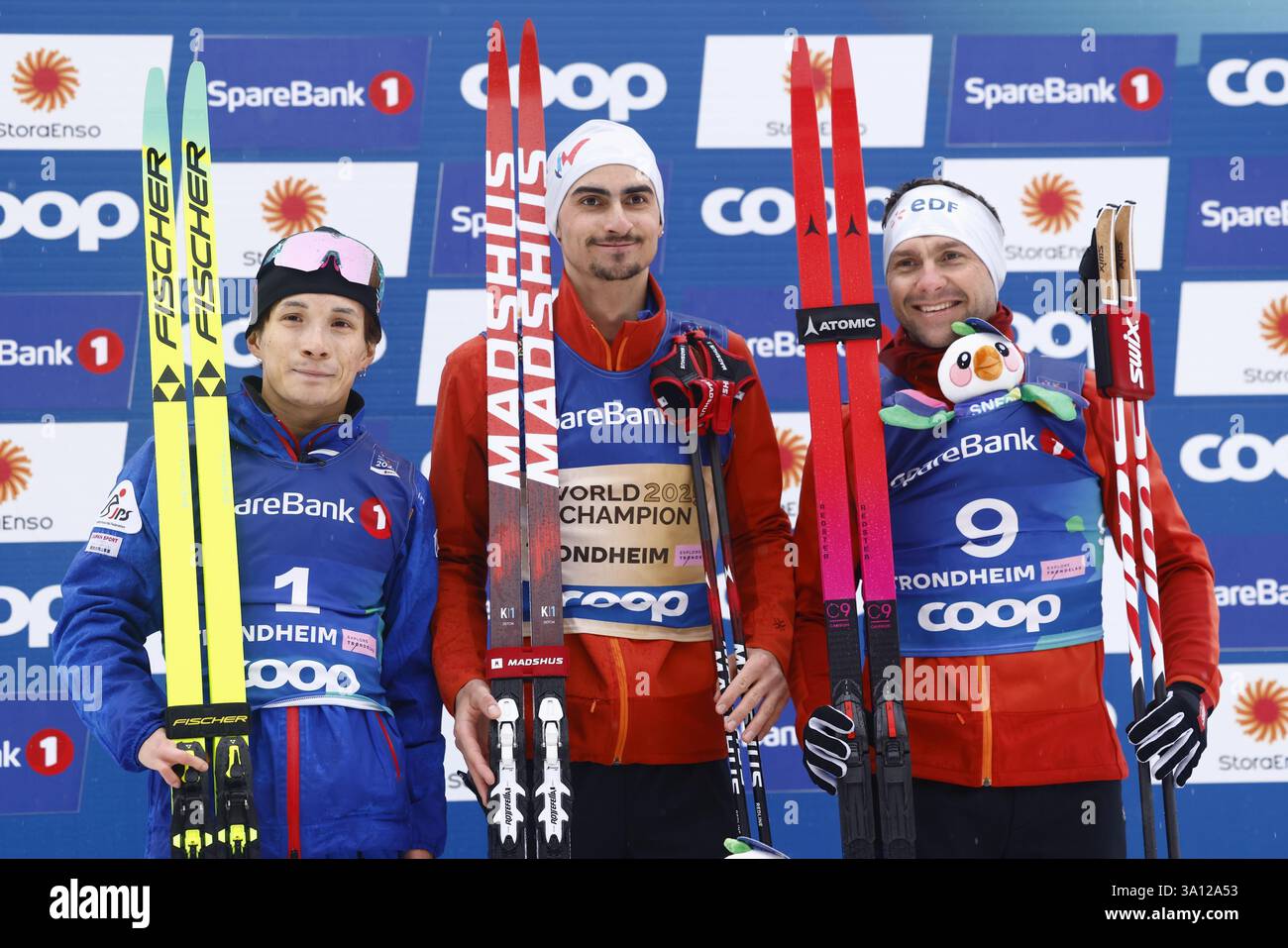 Karl Tabouret of France (C) poses for a photo after winning the para ...