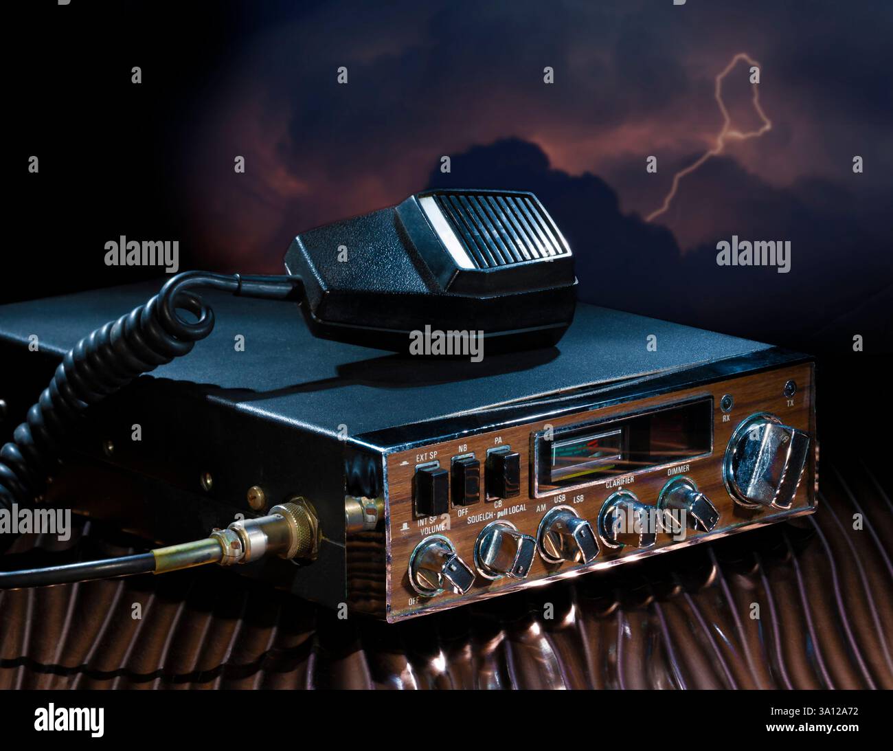 CB radio and microphone with a lightning storm behind Stock Photo - Alamy
