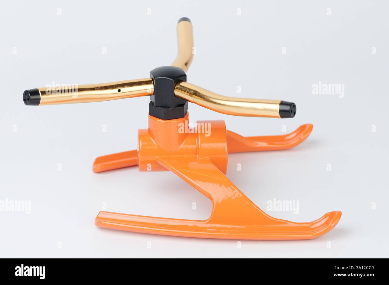 Metal sprinkle for garden grass side view isolated on studio background ...