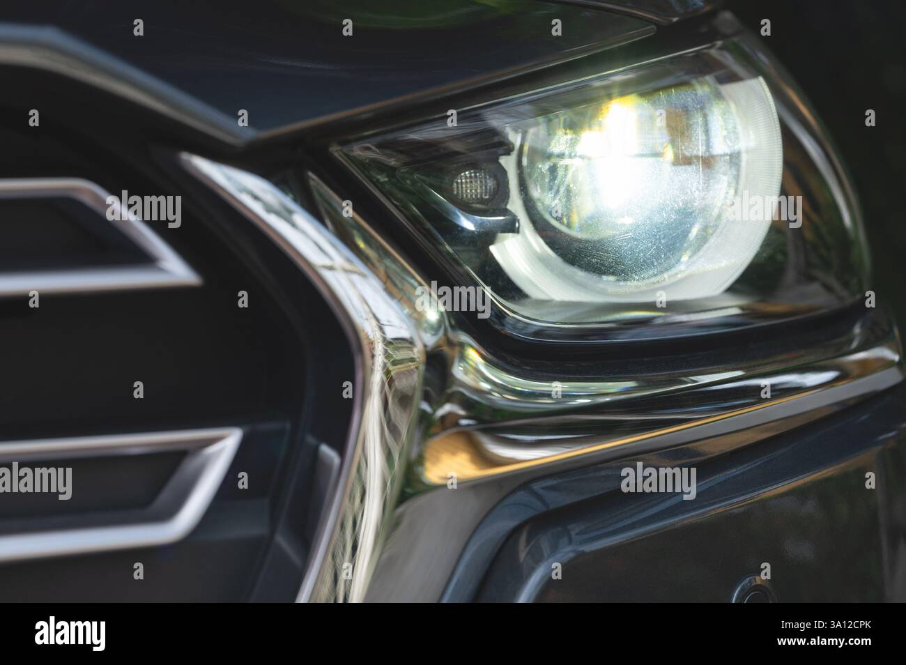 Low beam of led car headlight front close up view Stock Photo - Alamy