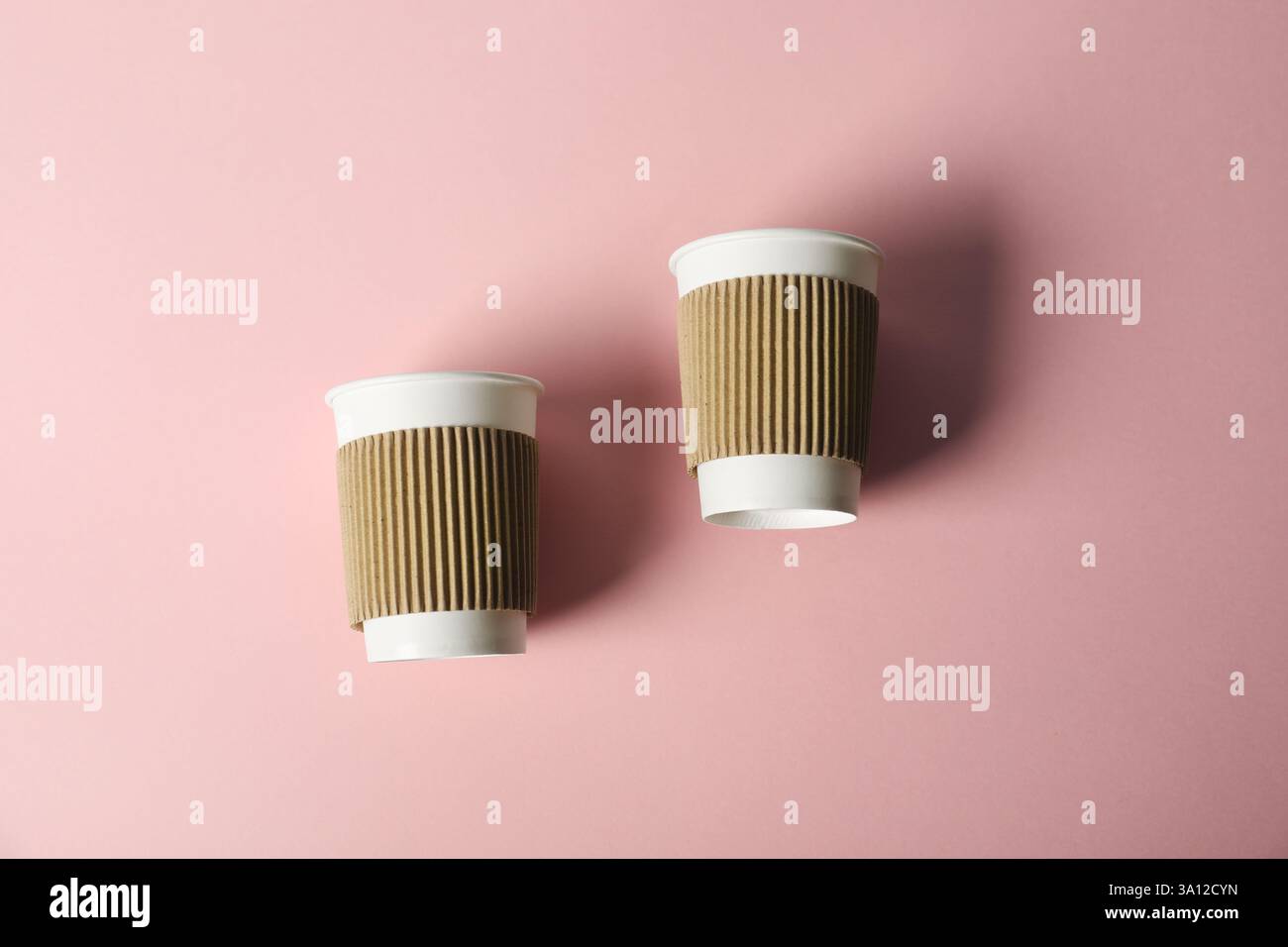 Paper cups on pink background, flat lay. Mockup for design Stock Photo ...