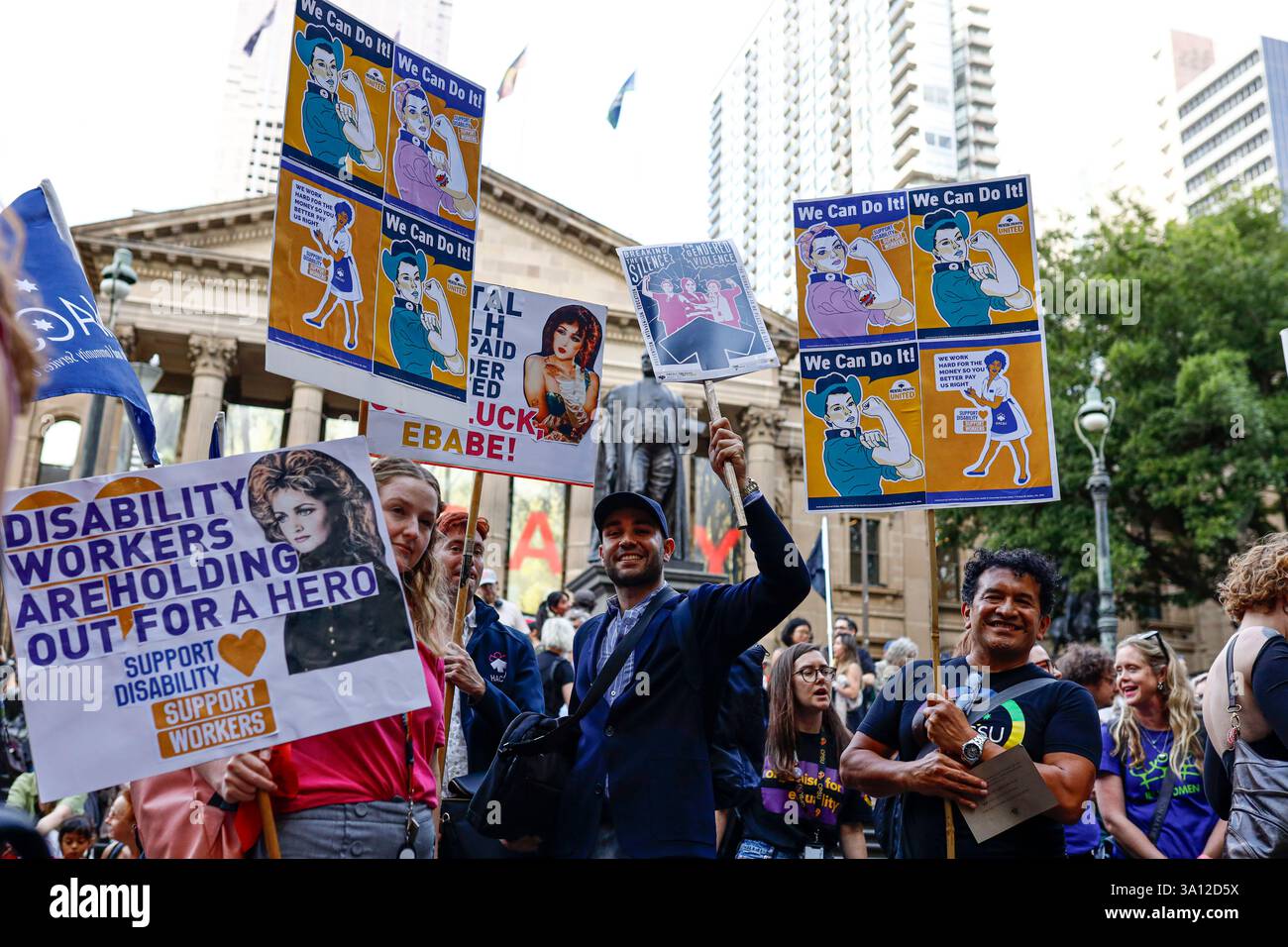 Protesters hold placards expressing their views during the ...