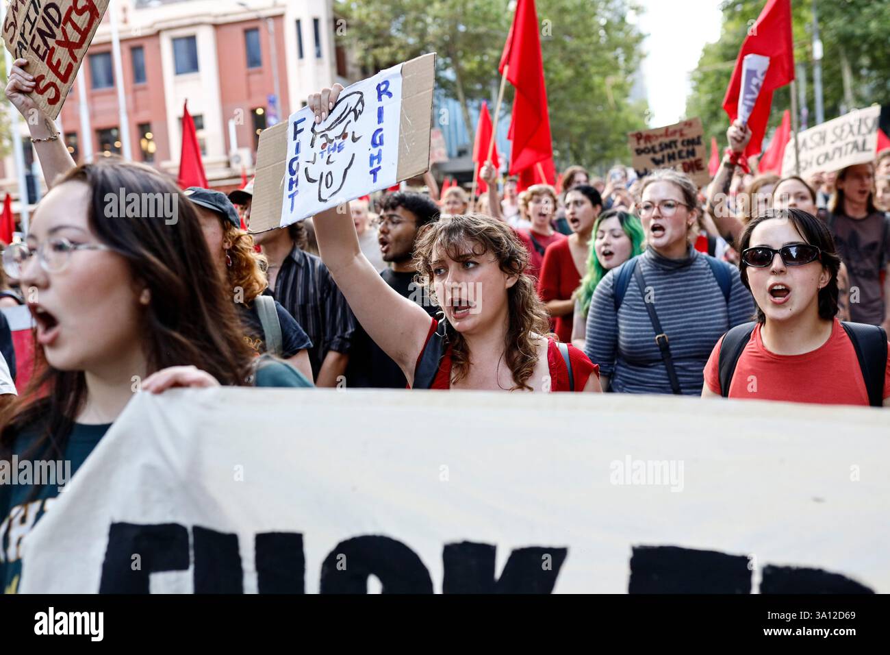 Protesters march with banners and signs while chanting slogans during ...