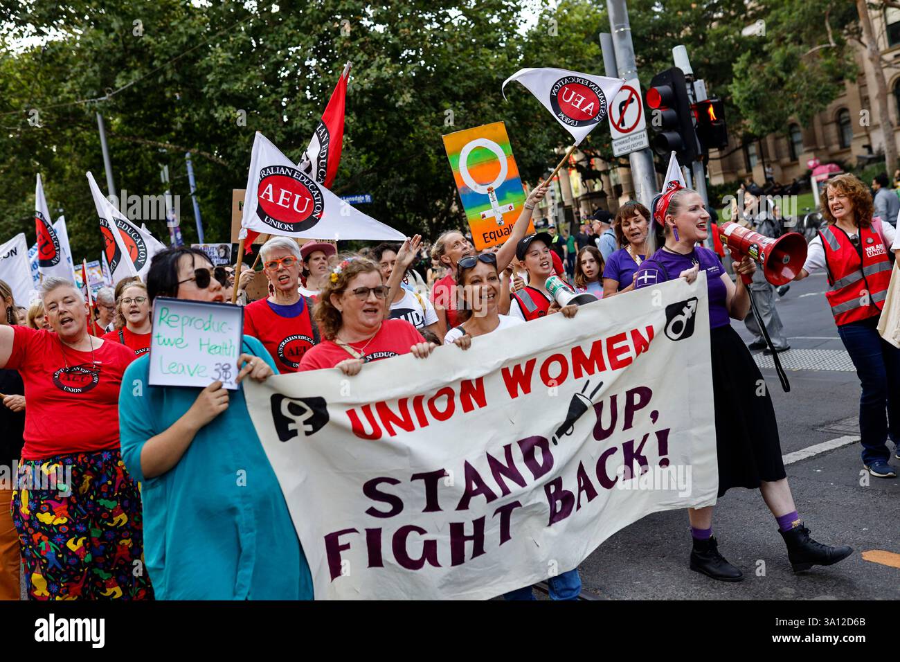 Protesters march with banners and signs while chanting slogans during ...