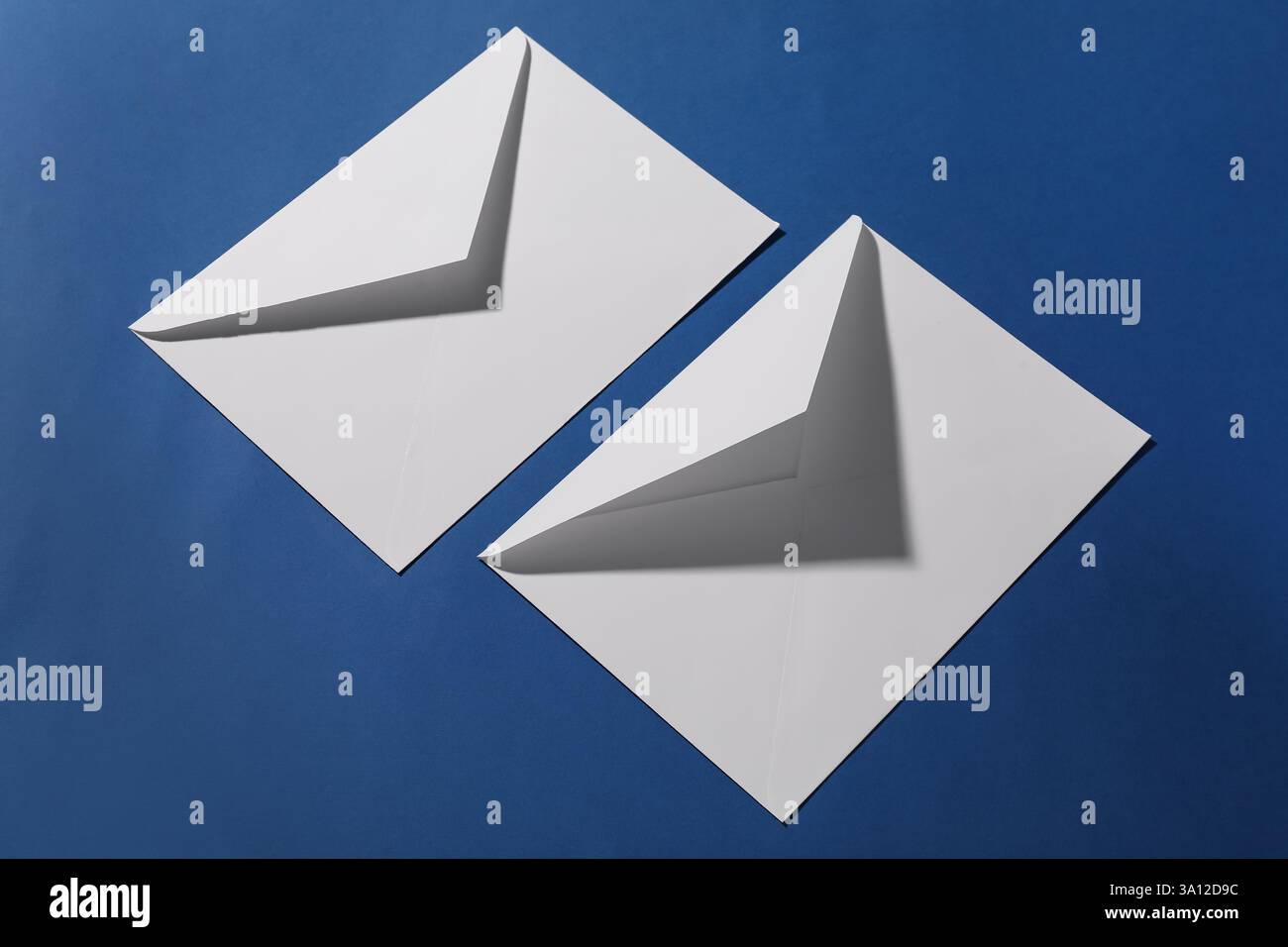Paper envelopes on blue background, above view. Mockup for design Stock ...