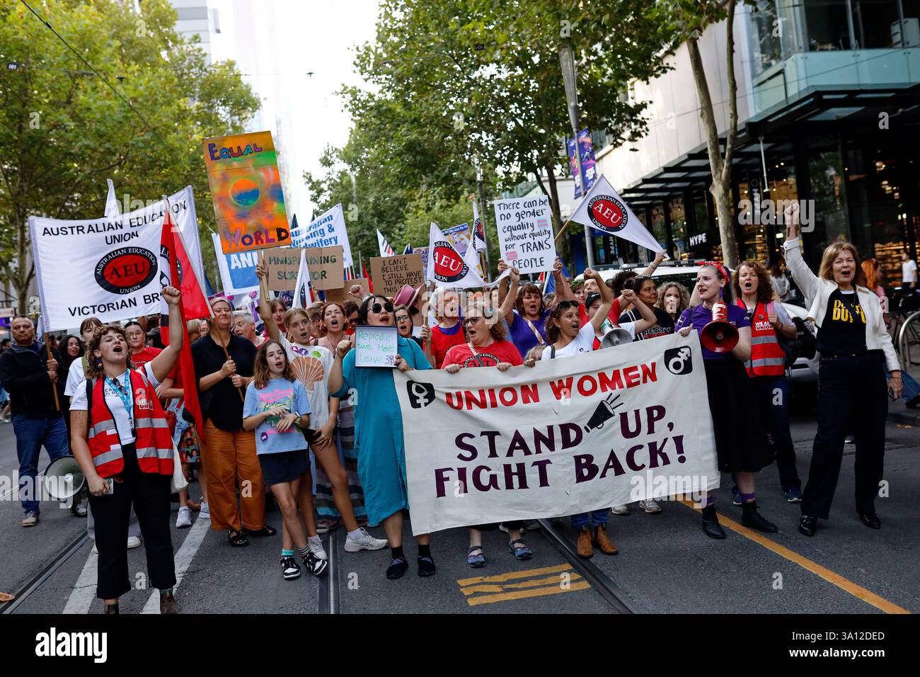 Protesters march with banners and signs while chanting slogans during ...